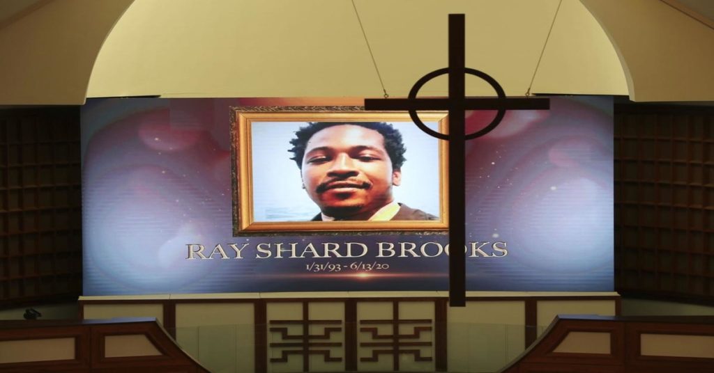 Despite rain fall, mourners say goodbye to Rayshard Brooks